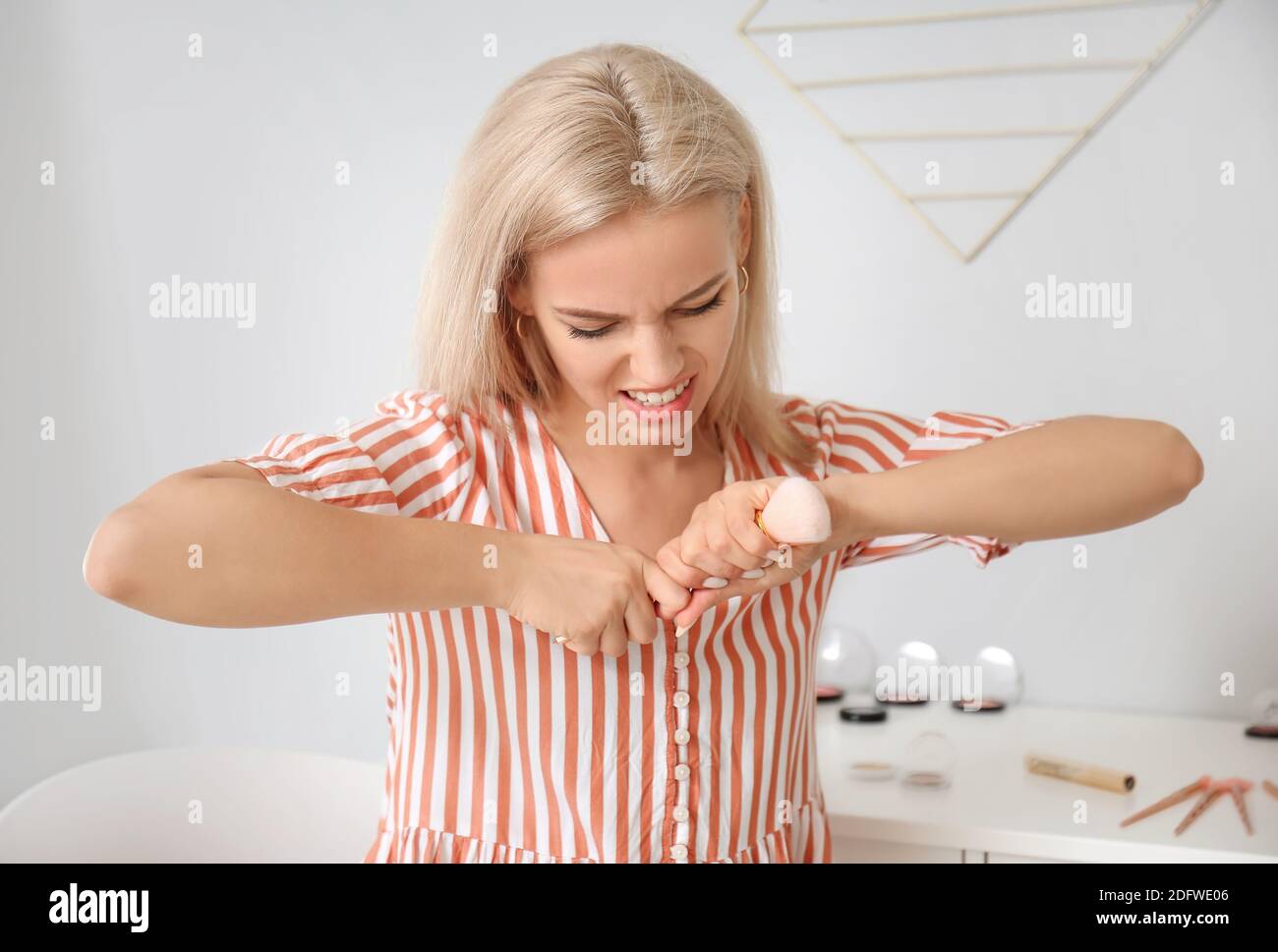Stressed makeup artist in beauty salon Stock Photo - Alamy