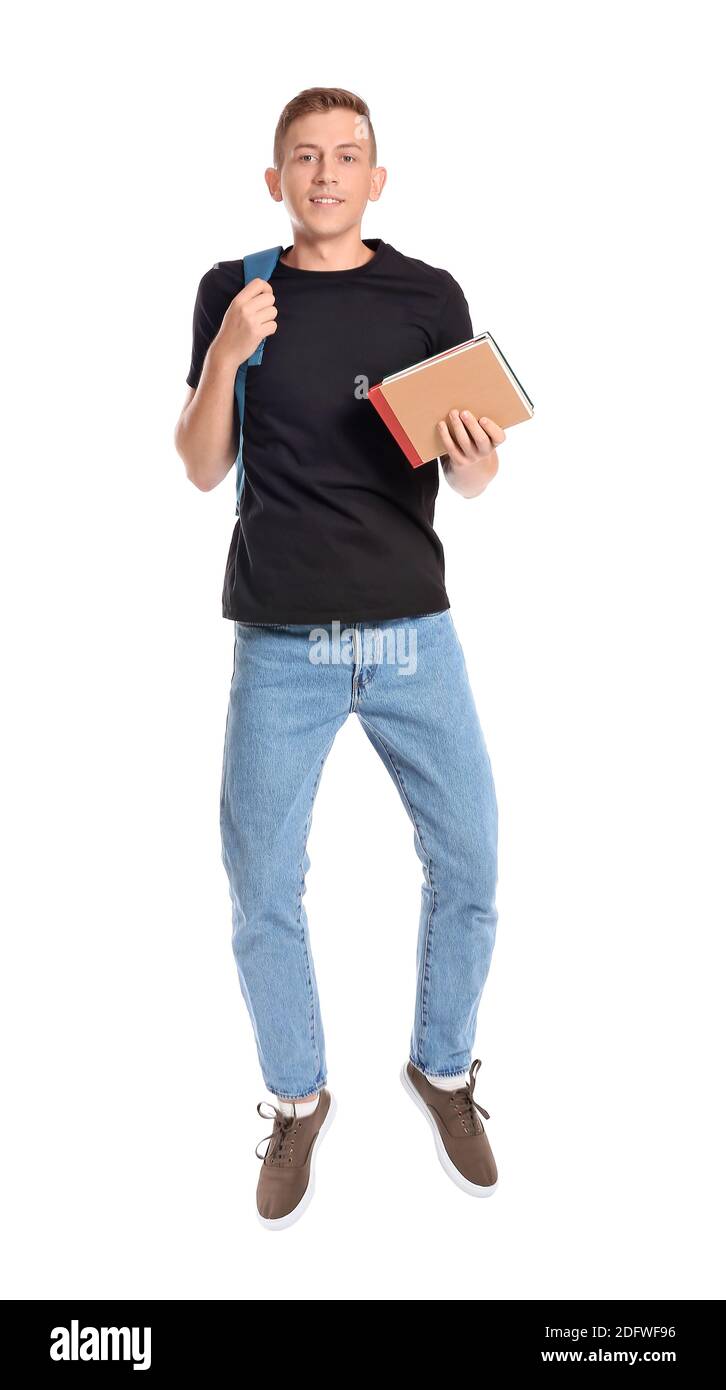 Jumping man with books and backpack on white background Stock Photo - Alamy