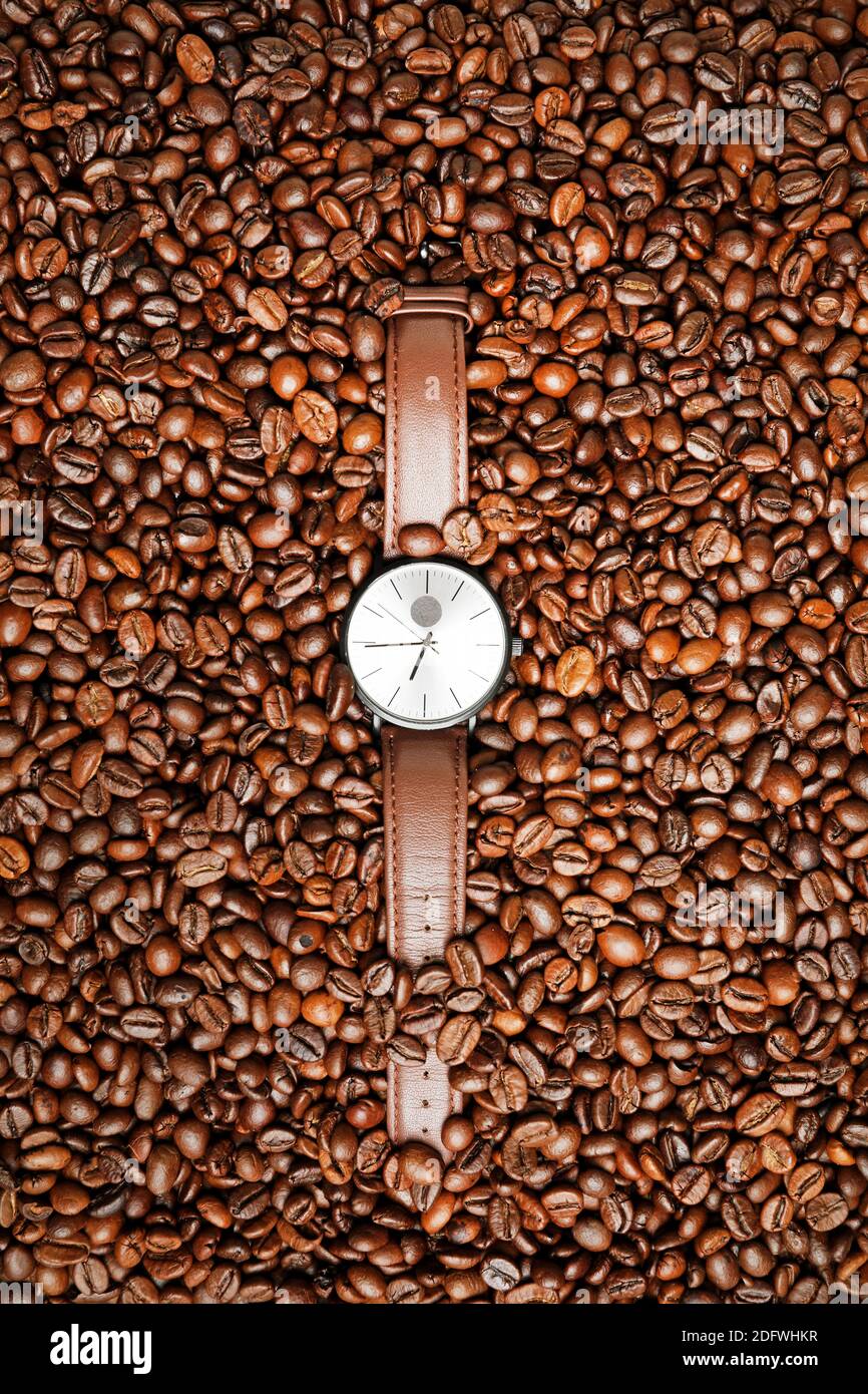 Wrist watch on coffee beans Stock Photo - Alamy