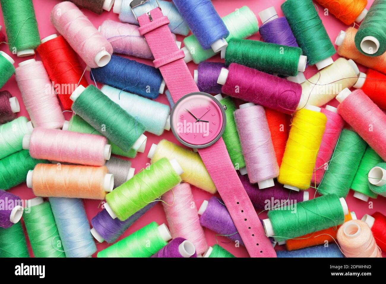 Wrist watch on sewing threads Stock Photo - Alamy
