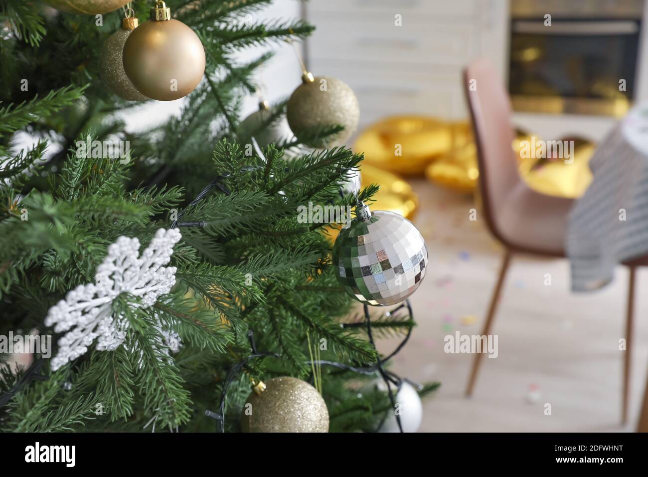 Christmas tree in messy room after New Year party celebration Stock ...