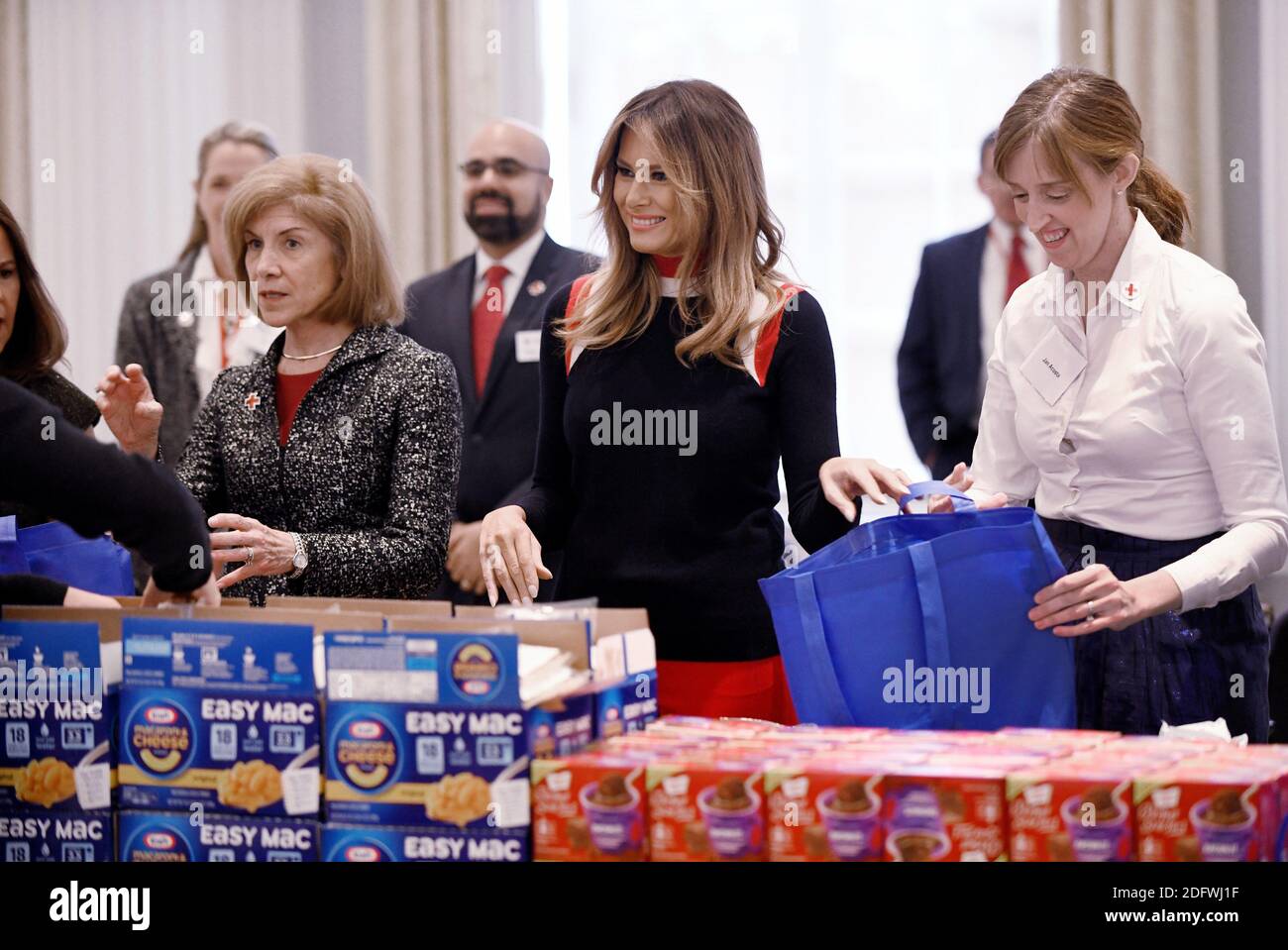 First lady Melania Trump (2-R) and Red Cross CEO Gail McGovern (L) fill ...