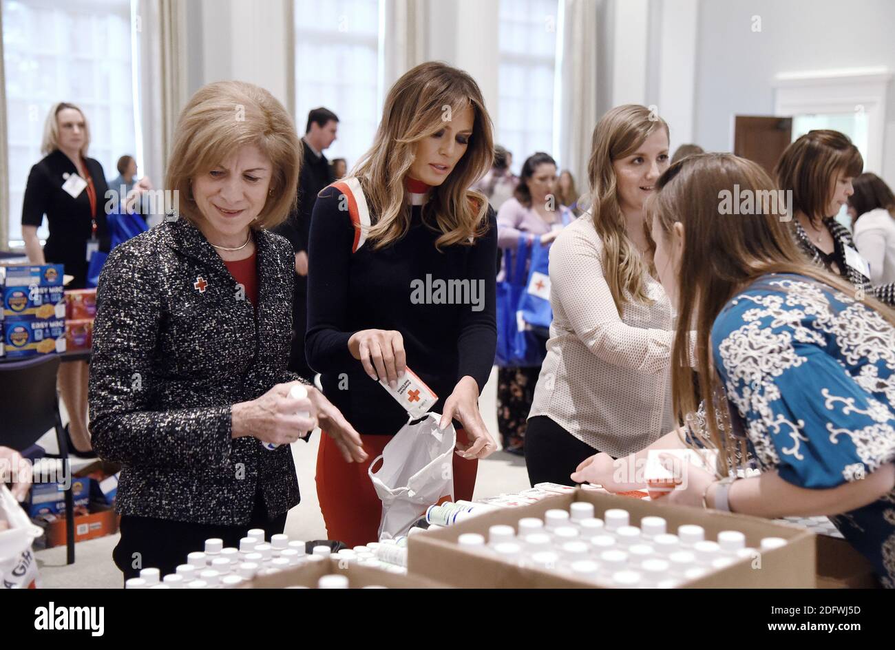 First lady Melania Trump and Red Cross CEO Gail McGovern (R) fill care ...