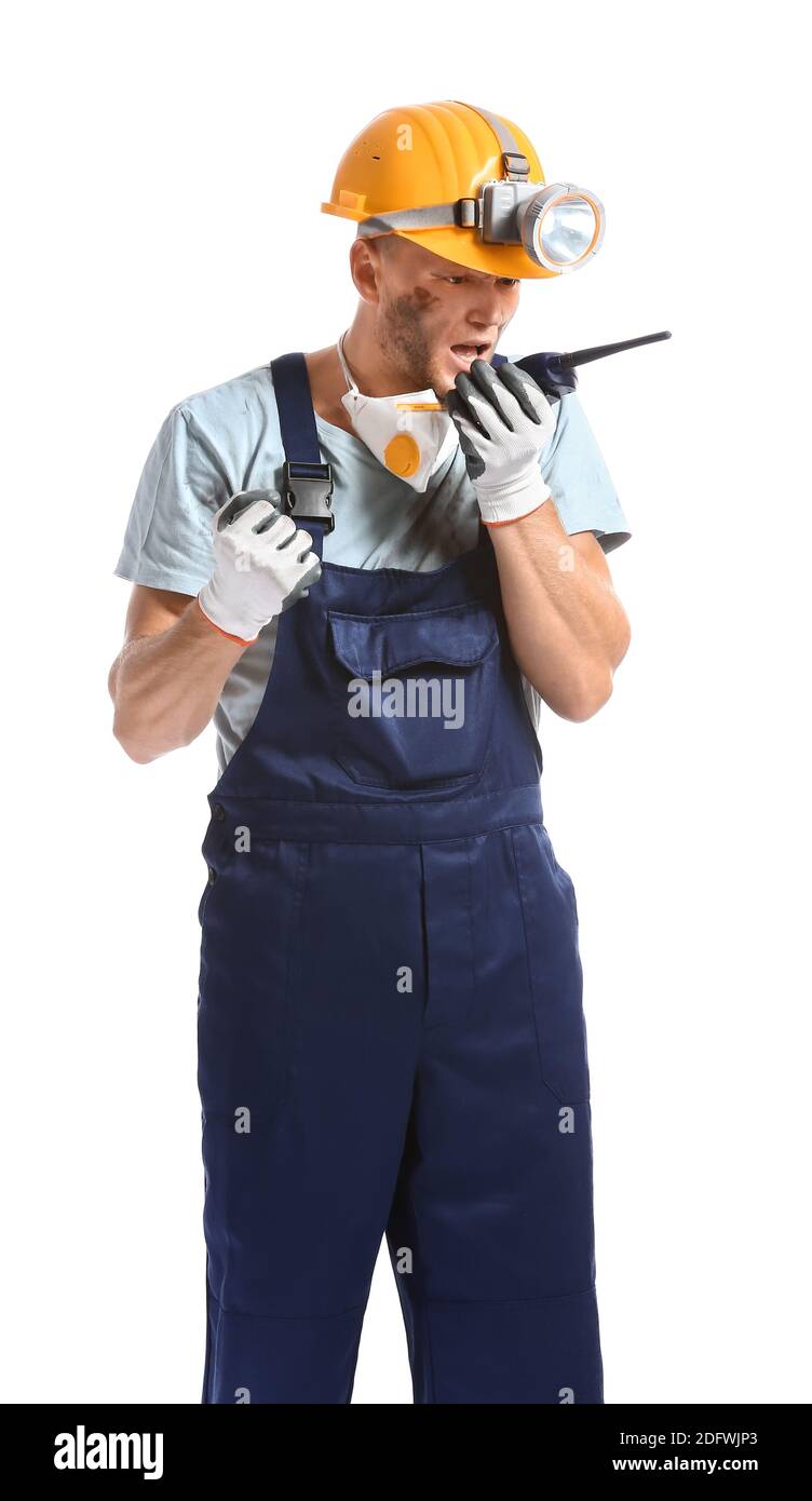 Miner man with two-way radio on white background Stock Photo - Alamy