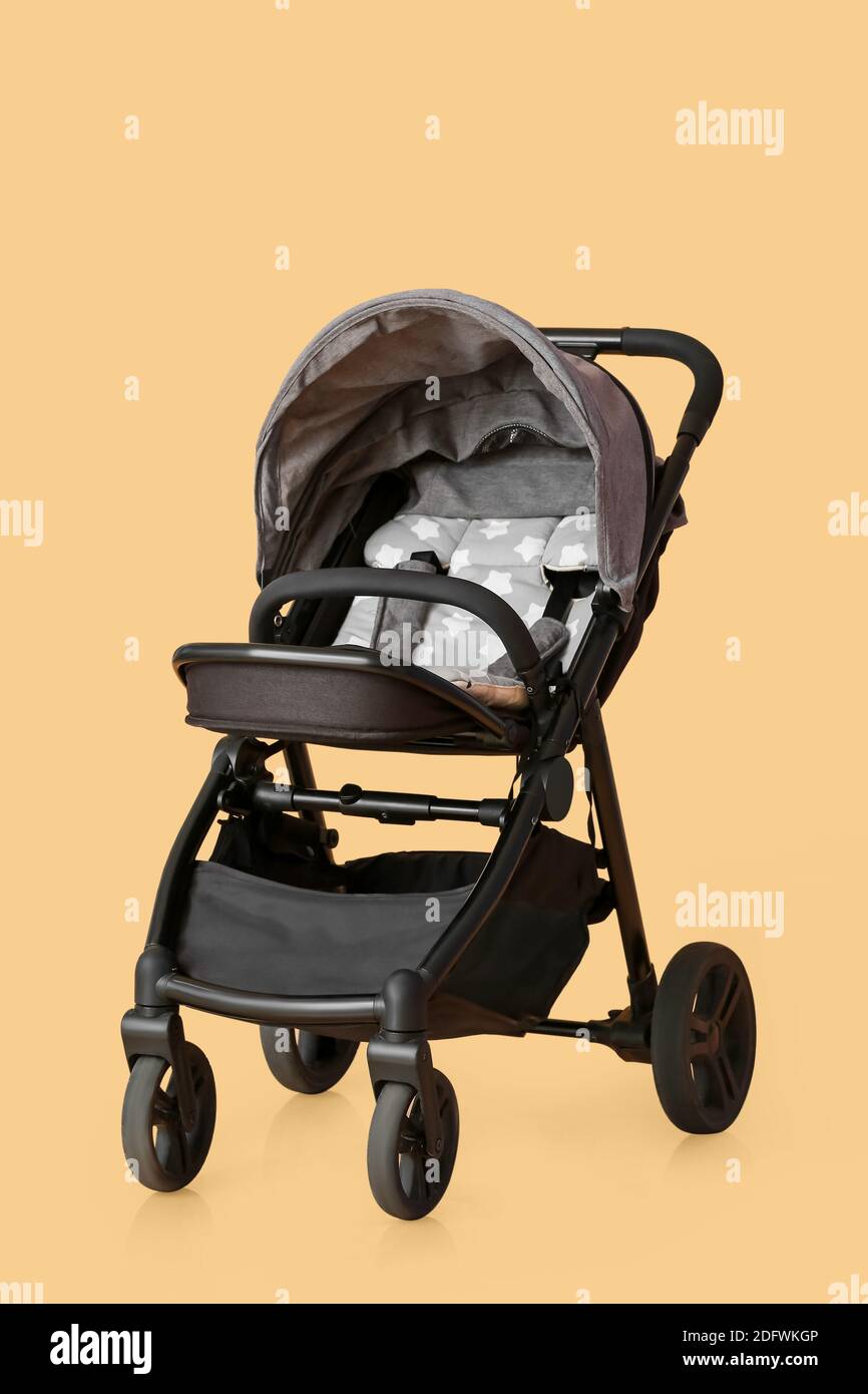 Modern baby stroller on color background Stock Photo - Alamy