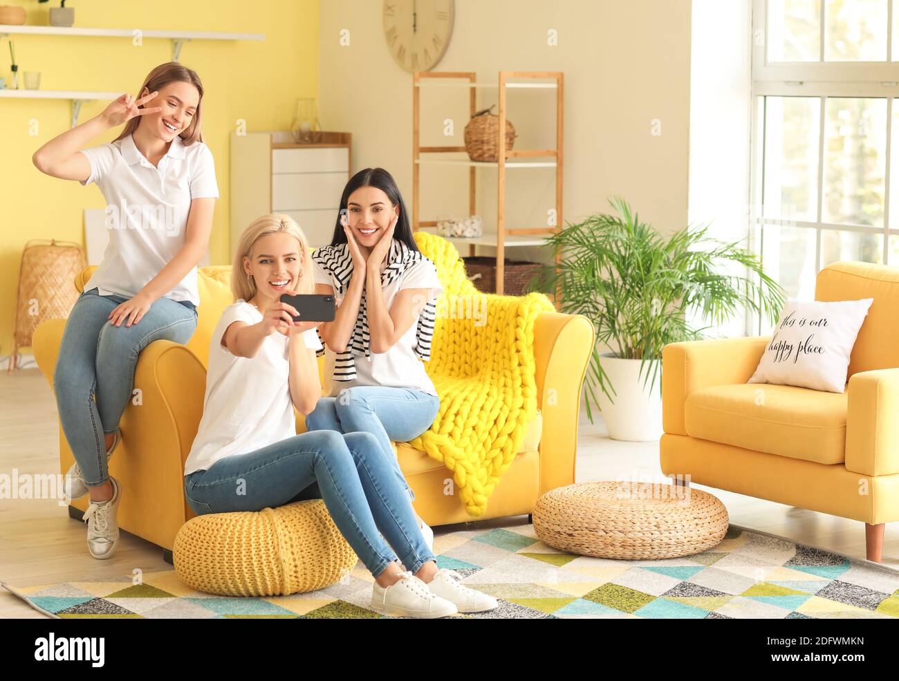 Beautiful young women taking selfie at home Stock Photo - Alamy