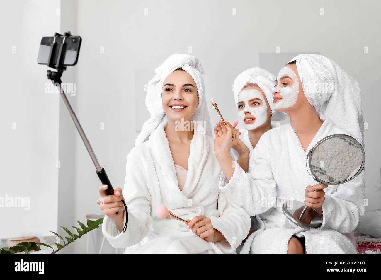 Beautiful young women taking selfie at pamper party Stock Photo - Alamy