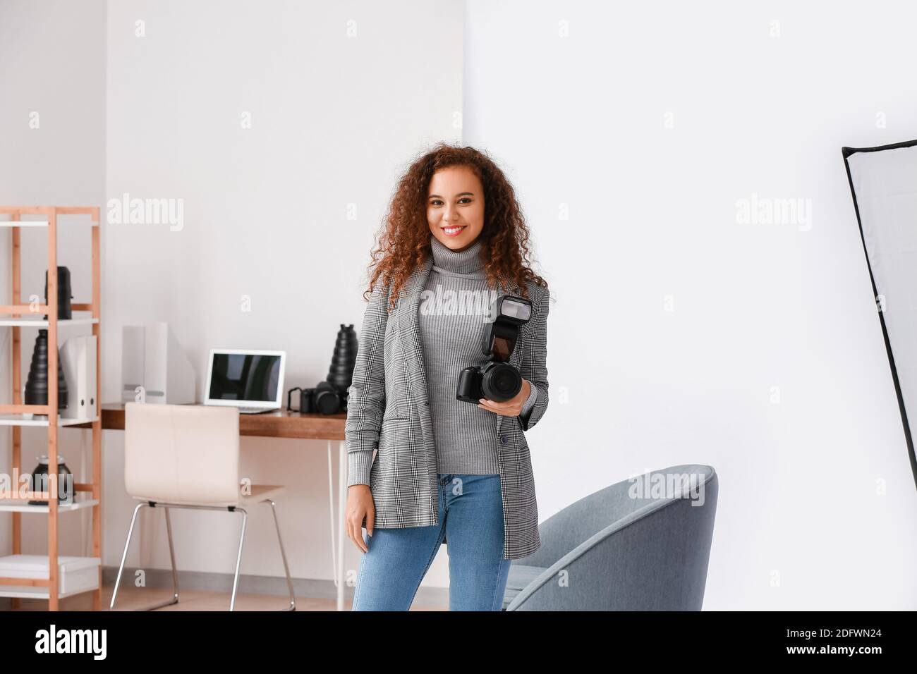 Female African-American photographer in studio Stock Photo - Alamy