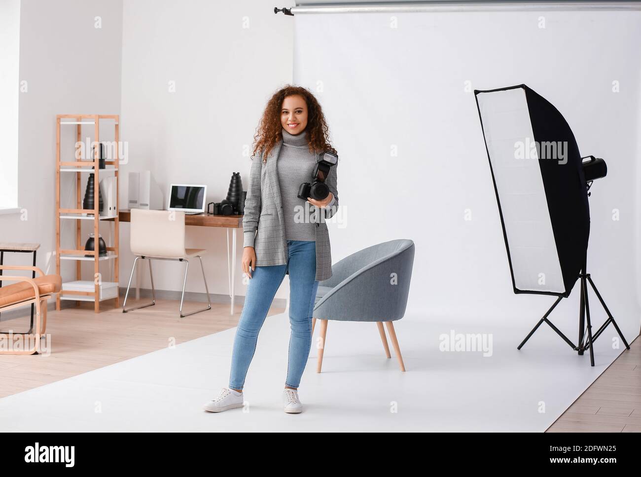 Female African-American photographer in studio Stock Photo - Alamy