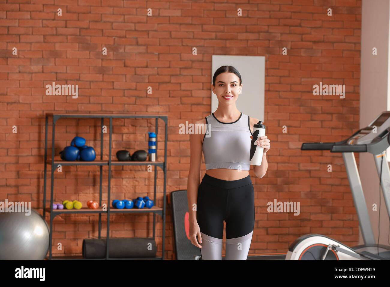 Portrait of female coach in gym Stock Photo - Alamy