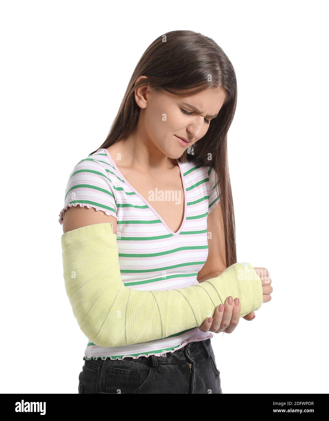 Young woman with broken arm on white background Stock Photo - Alamy