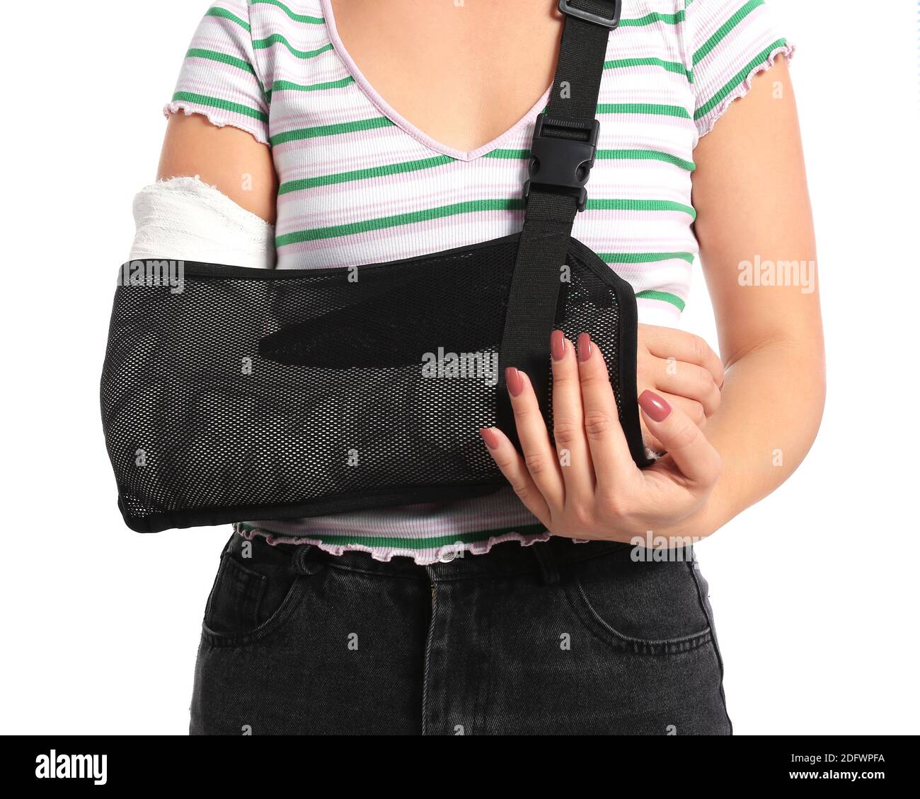 Young woman with broken arm on white background Stock Photo - Alamy