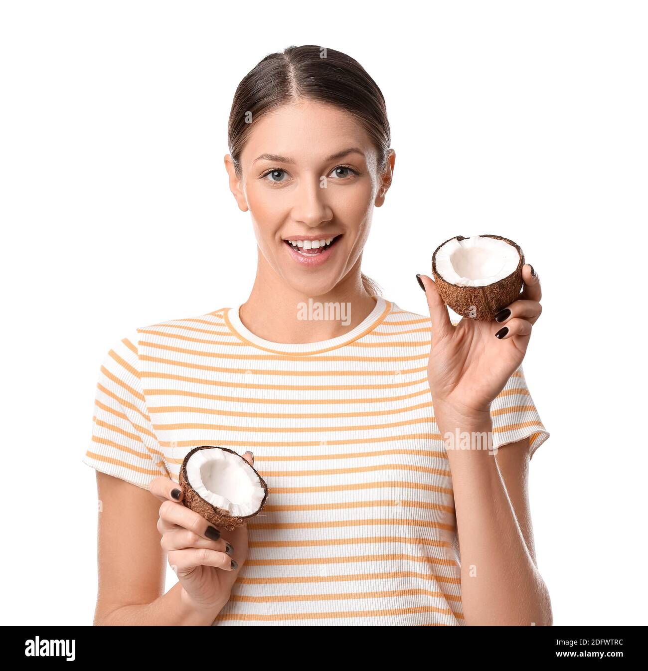 Beautiful young woman with coconut on white background Stock Photo - Alamy
