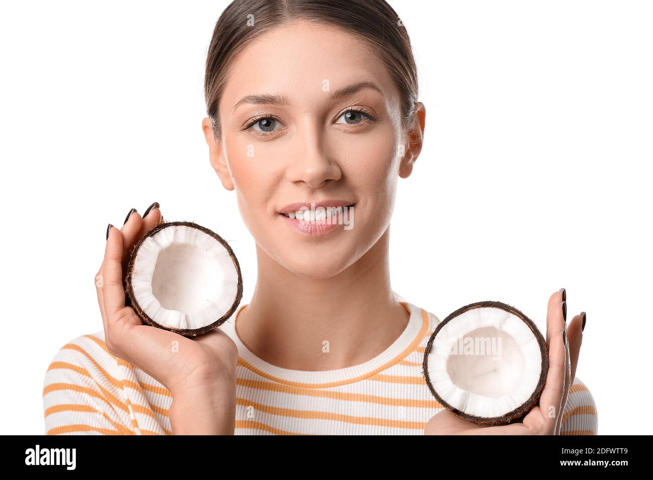 Beautiful young woman with coconut on white background Stock Photo - Alamy
