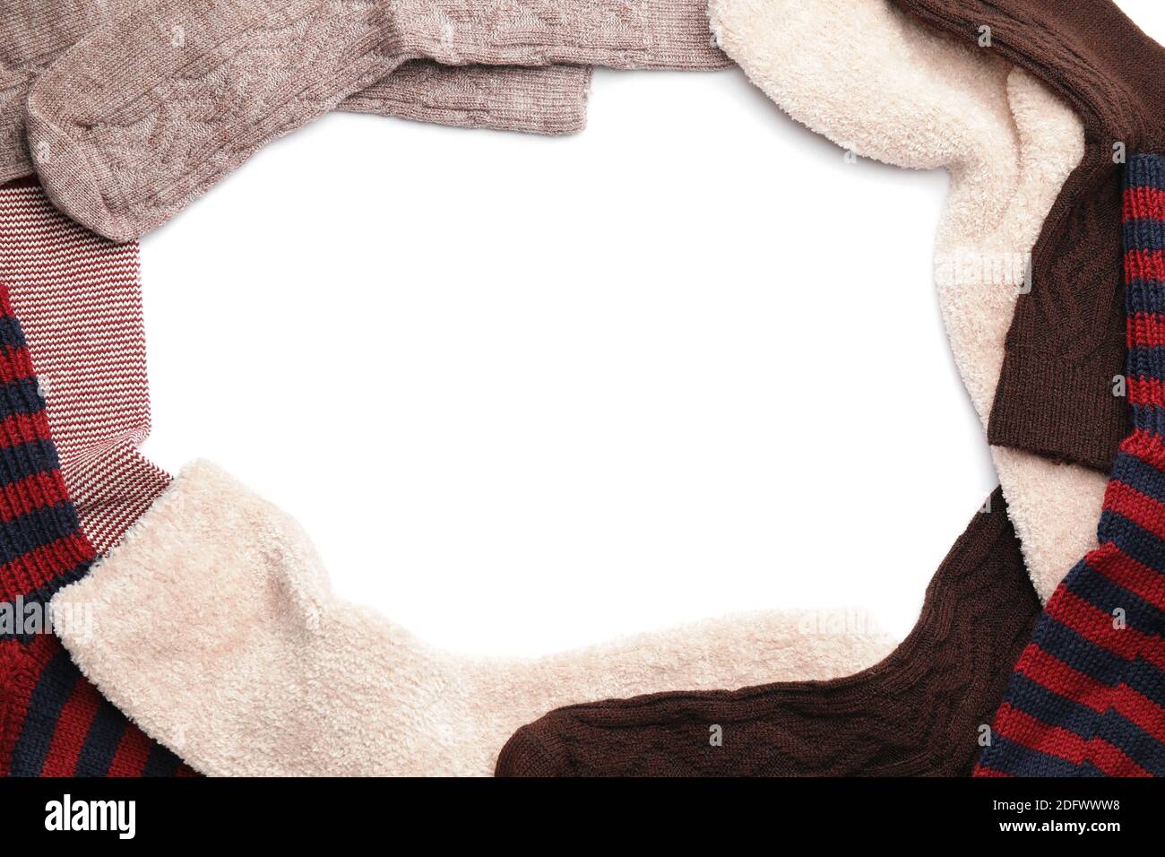 Frame made of warm socks on white background Stock Photo - Alamy