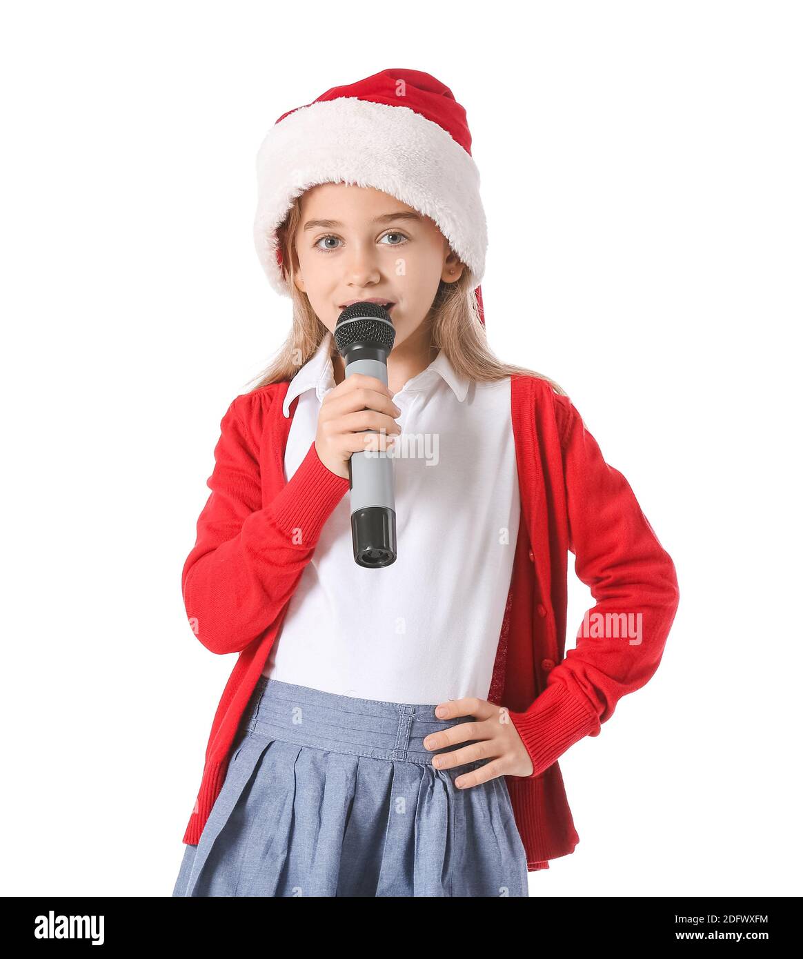 Cute little girl in Santa hat singing Christmas song on white ...