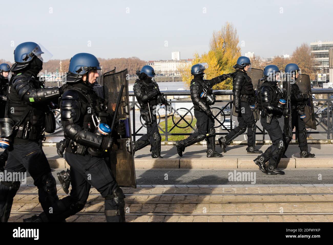 French riot police officers take position during a demonstration of ...