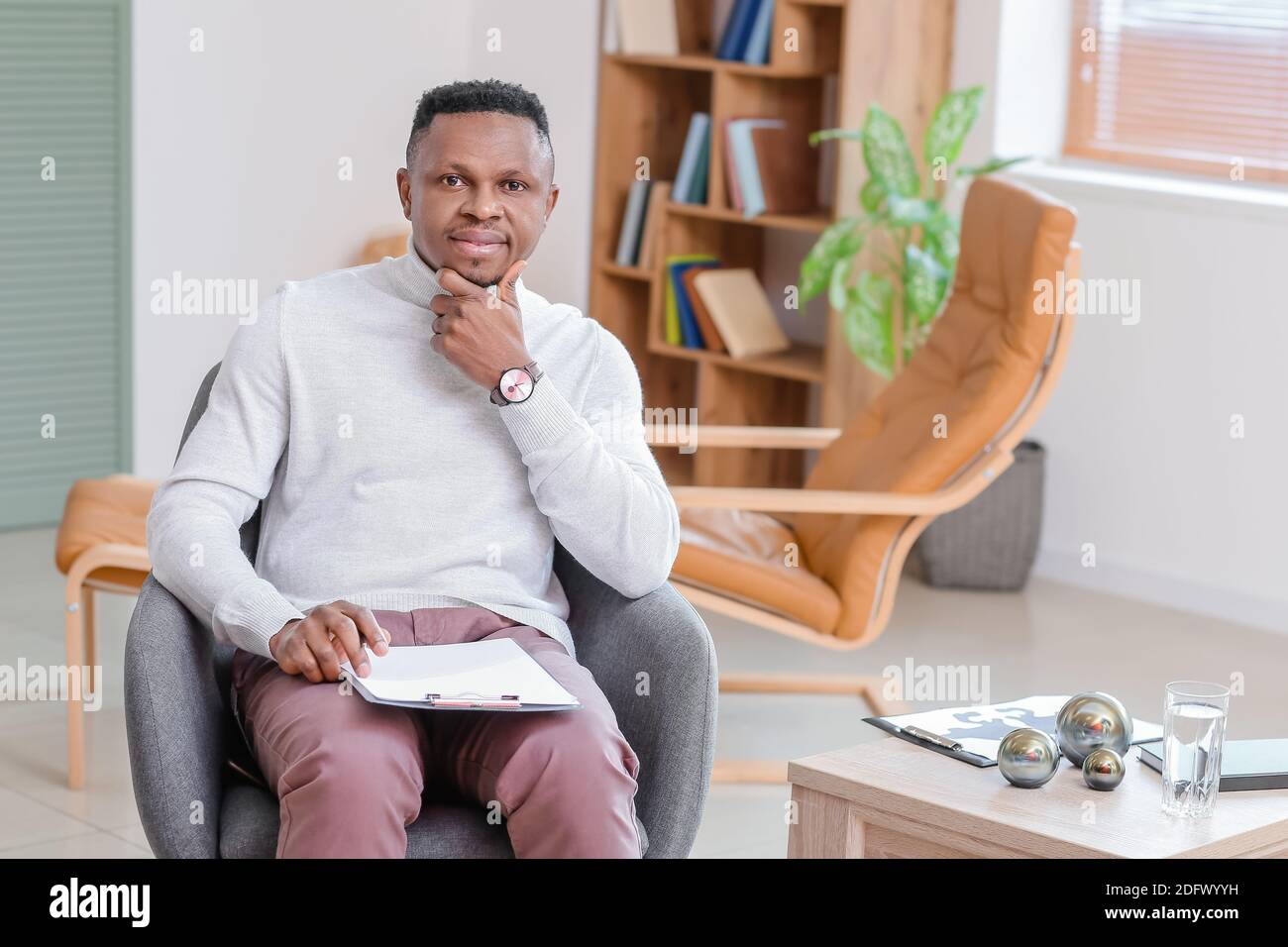 Portrait of male African-American psychologist in office Stock Photo ...