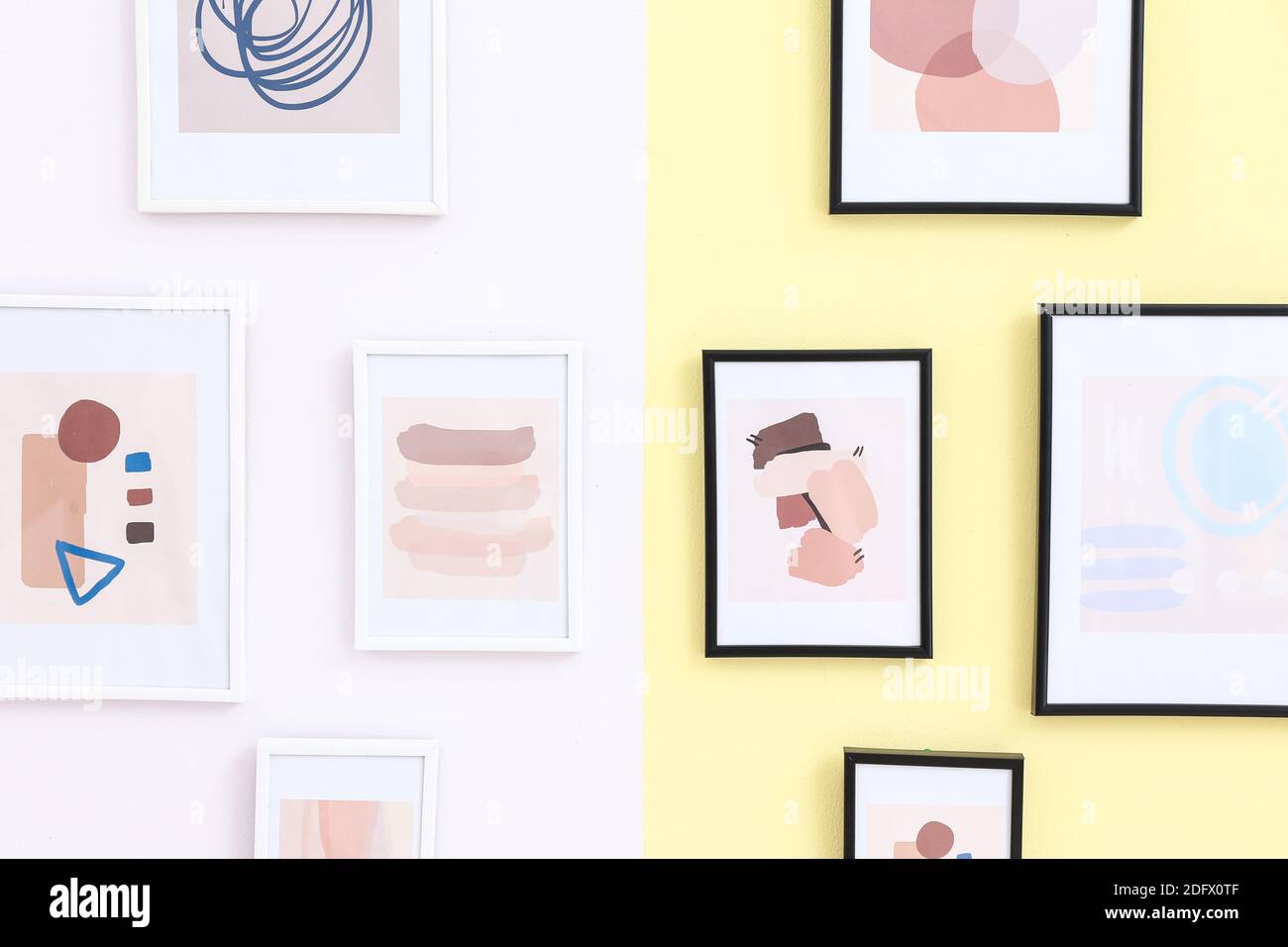 Beautiful pictures hanging on color wall Stock Photo - Alamy