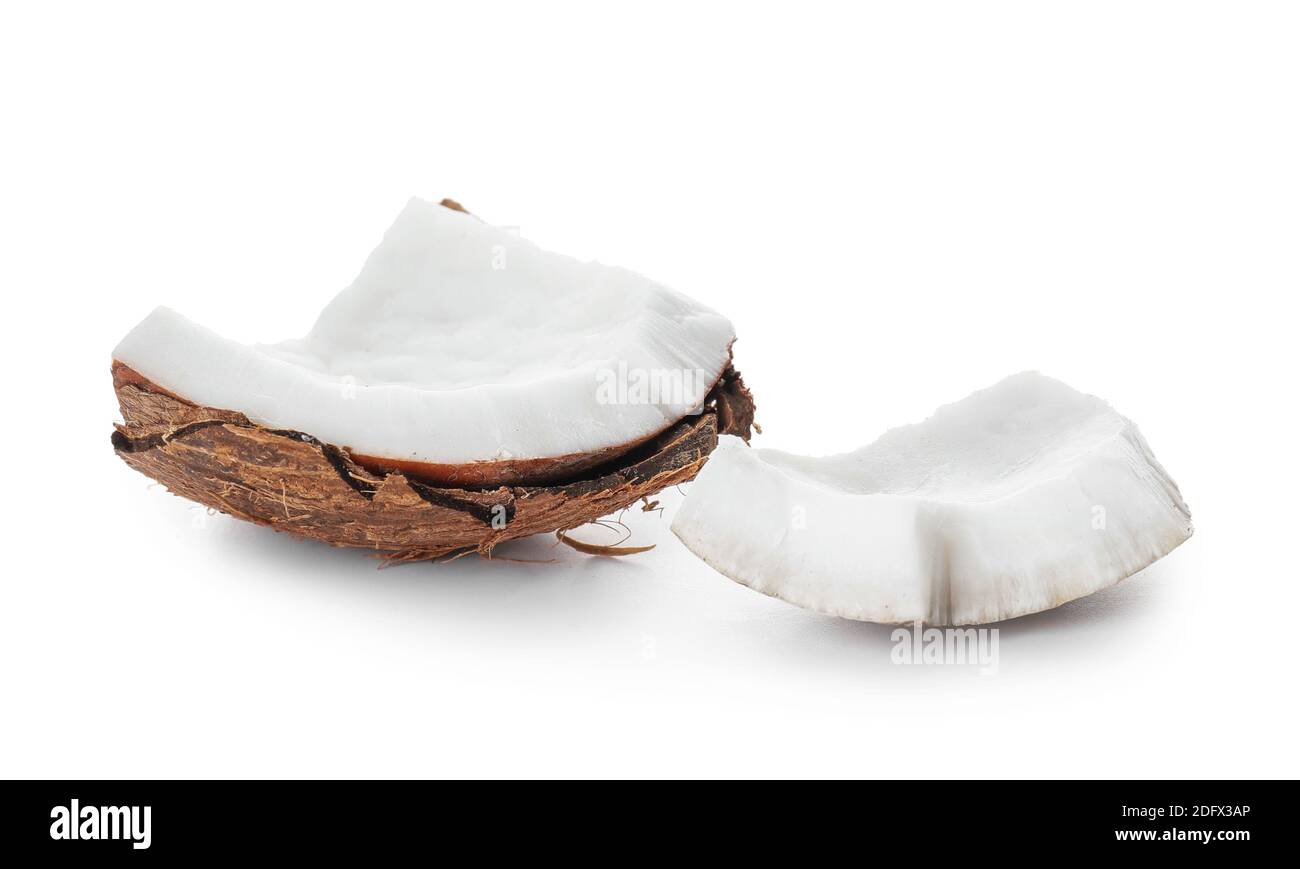 Pieces of ripe coconut on white background Stock Photo - Alamy