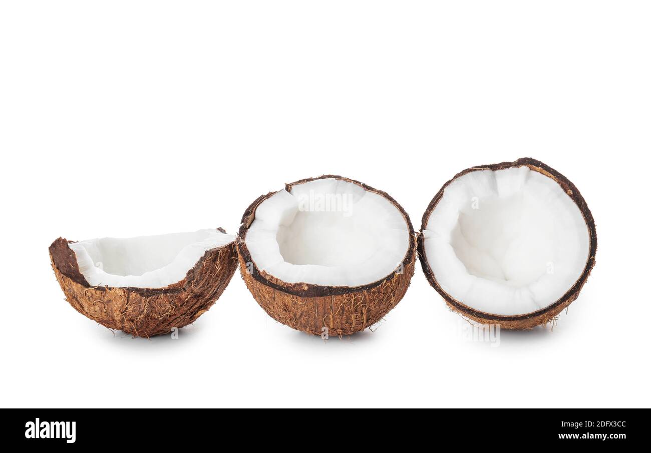 Halves of ripe coconut on white background Stock Photo - Alamy
