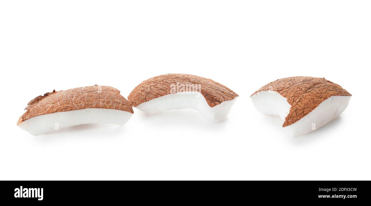 Pieces of ripe coconut on white background Stock Photo - Alamy
