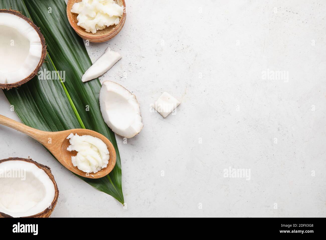 Composition with coconut oil on light background Stock Photo - Alamy