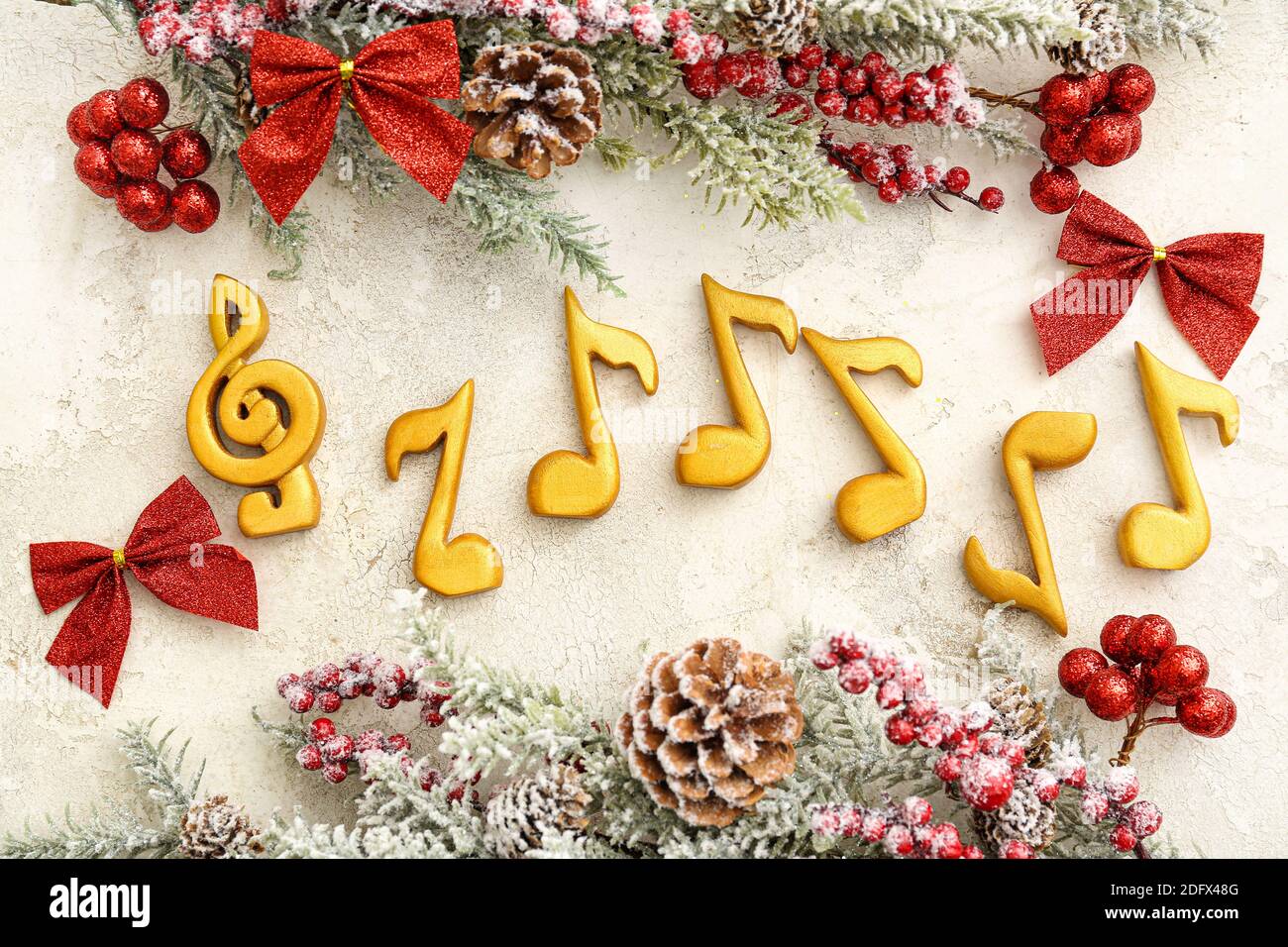 Note signs and Christmas decor on light background Stock Photo - Alamy