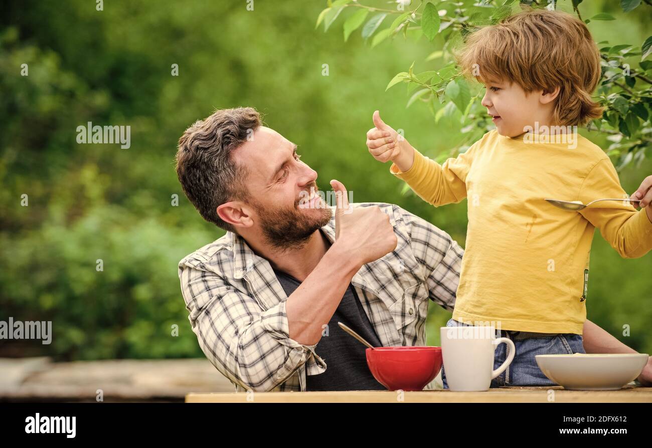 Menu for children. Homemade meal. Food habits. Little boy with dad ...