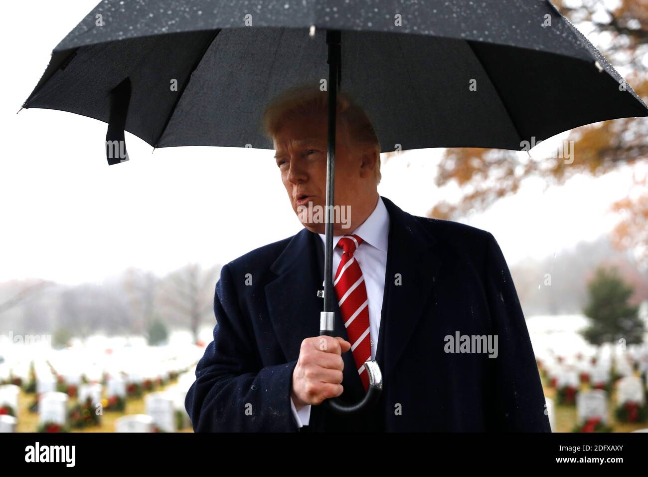 U.S. President Donald Trump talks reports as he visits Section 60 at ...