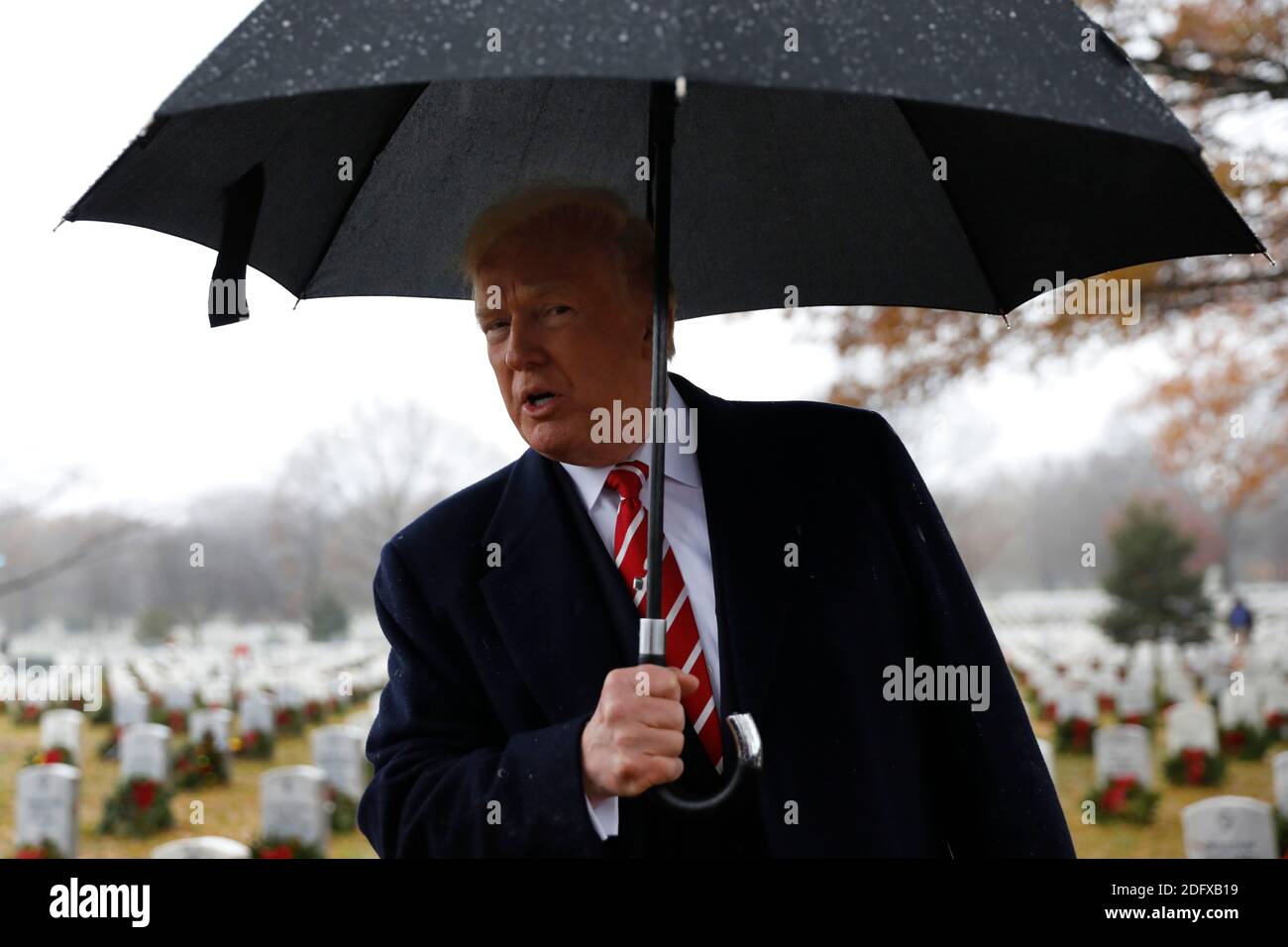 U.S. President Donald Trump talks reports as he visits Section 60 at ...