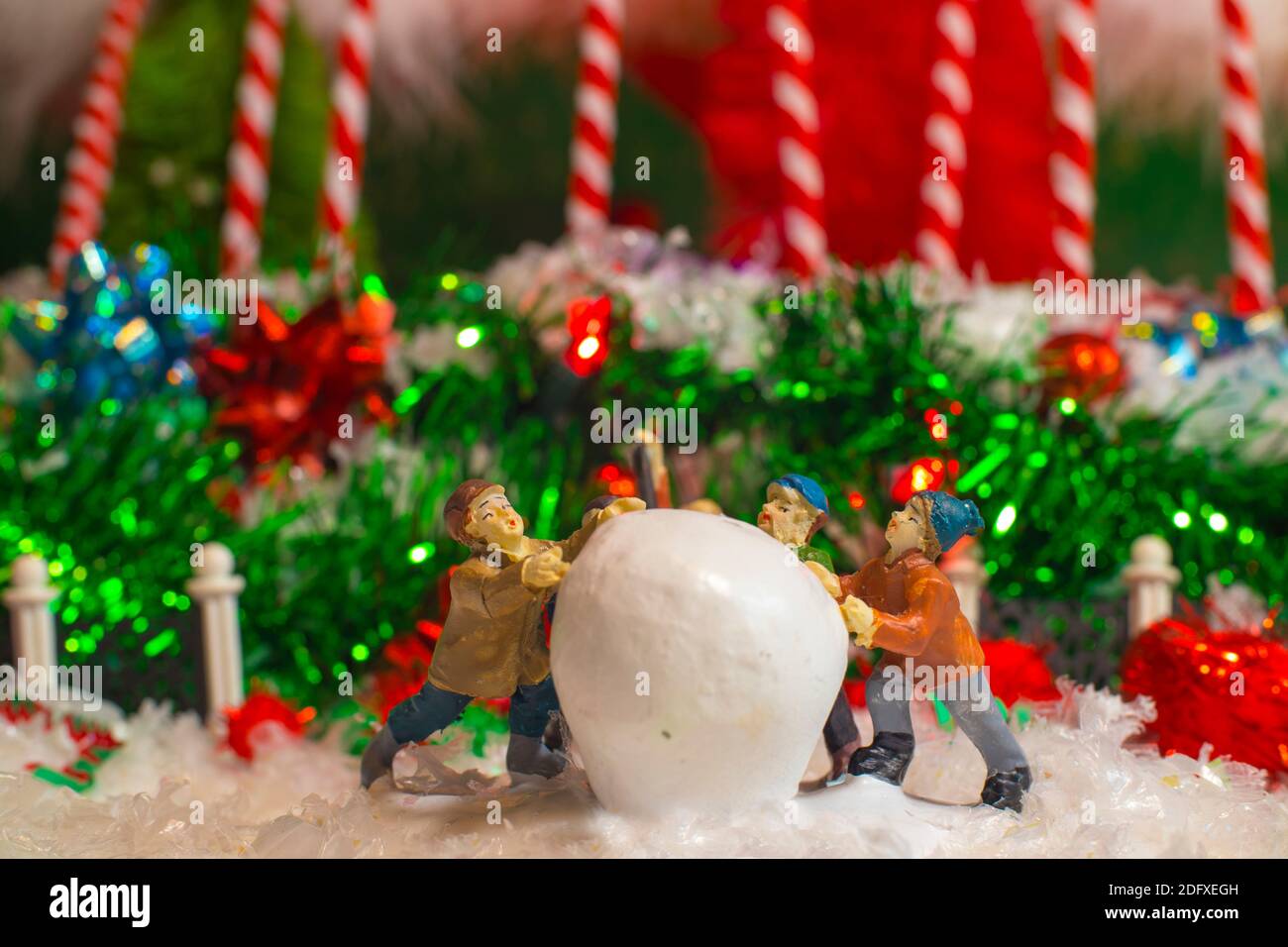 Christmas holiday decorations scene Kids pushing a large snowball scene ...