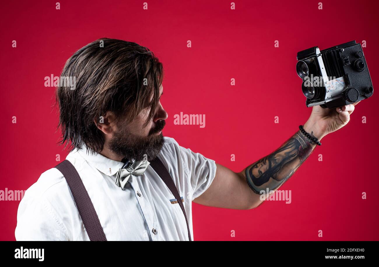 confident elegant photographer hold classical camera. journalist with ...