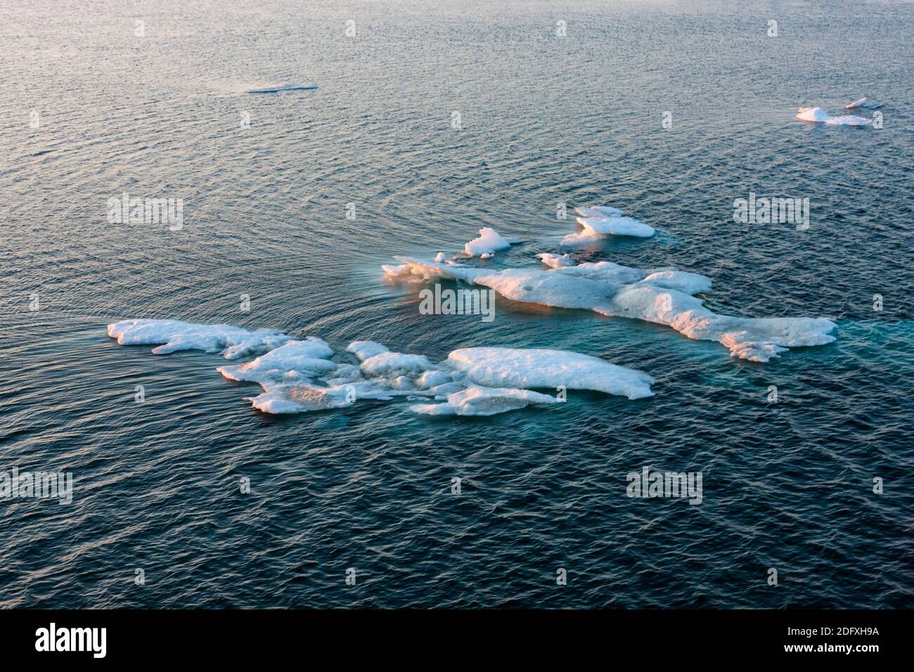 Sunset view of floating ice on Bering Sea, Russia Far East Stock Photo ...