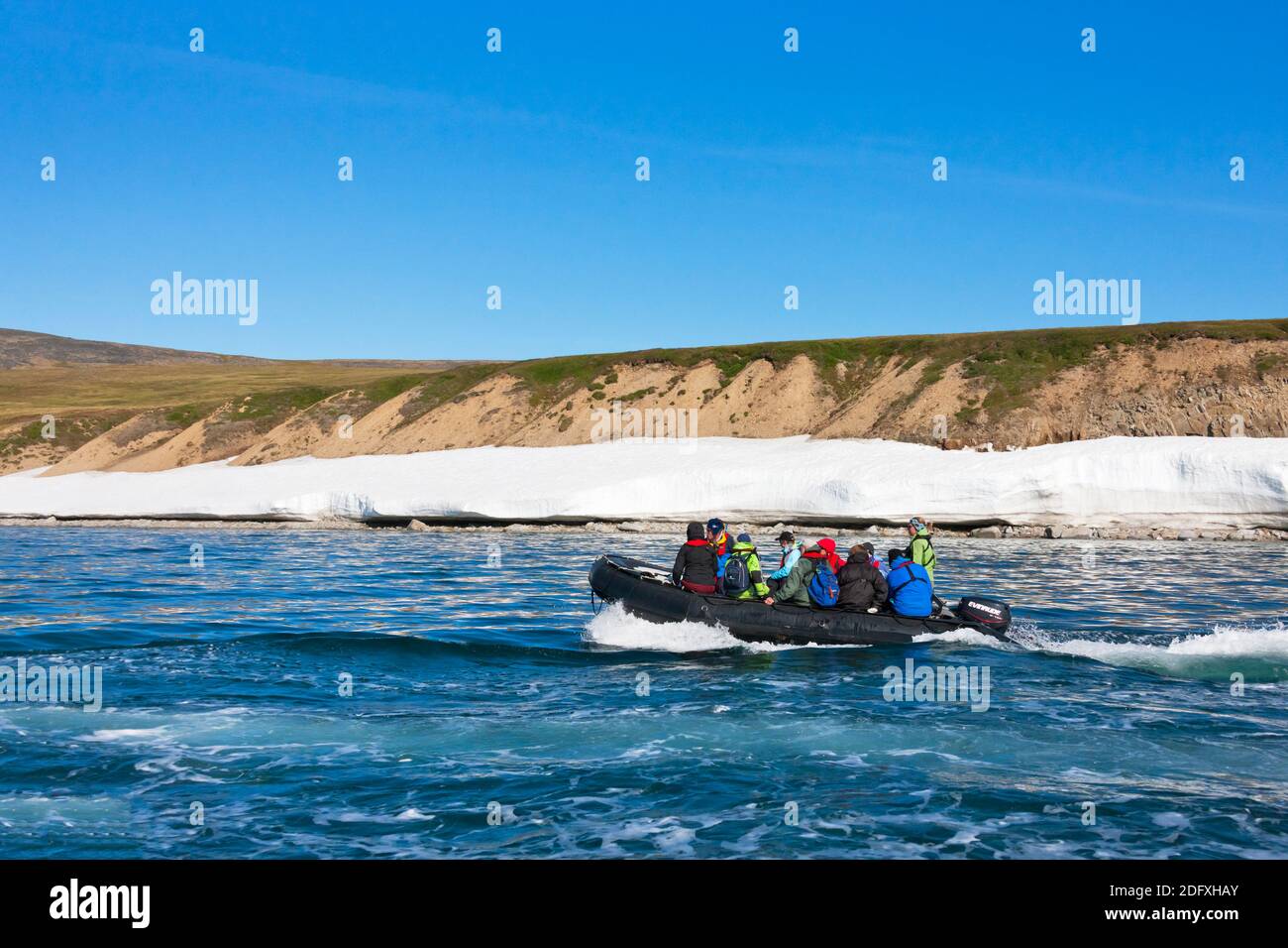 Zodiac approaching island in Cape Onman, Chukchi Sea, Russia Far East ...
