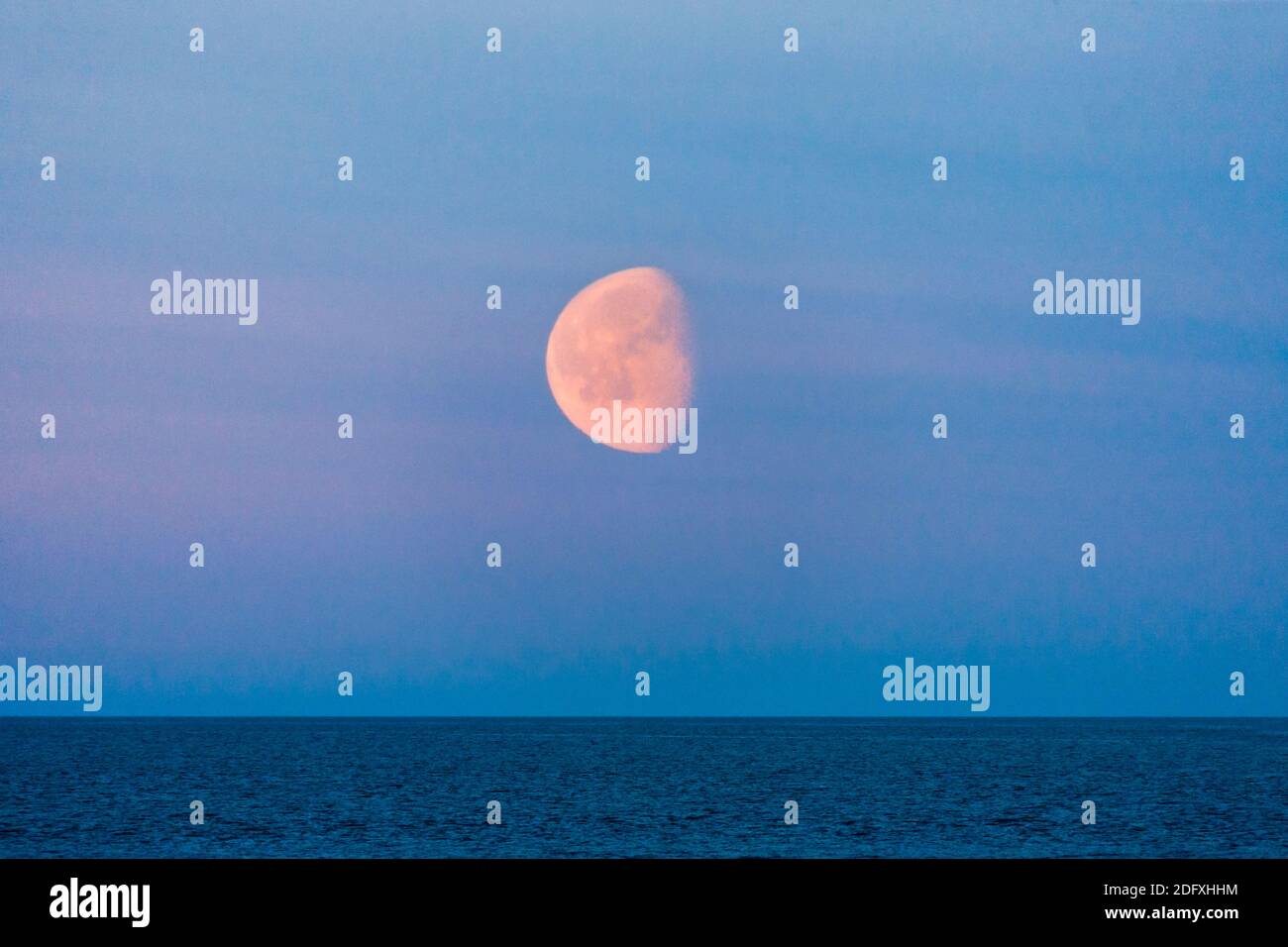 Moon over sunset hi-res stock photography and images - Alamy