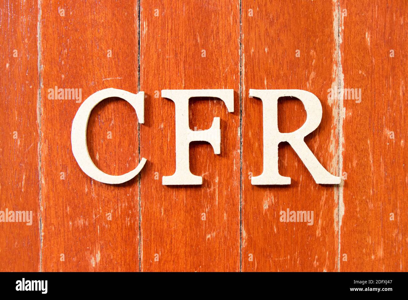Alphabet letter in word CFR (abbreviation Cost and freight) on old red ...