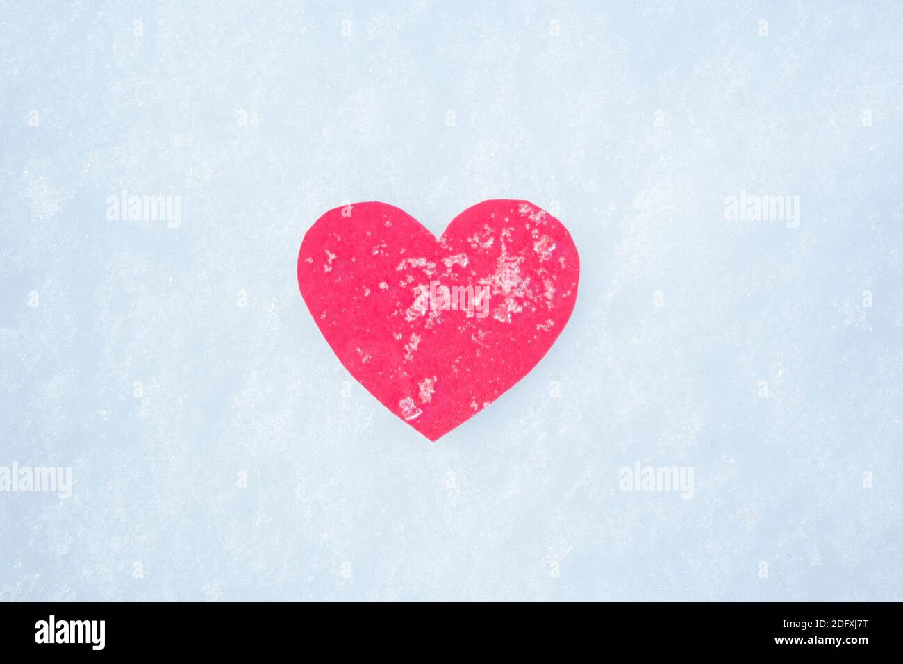 Heart on snow hi-res stock photography and images - Alamy