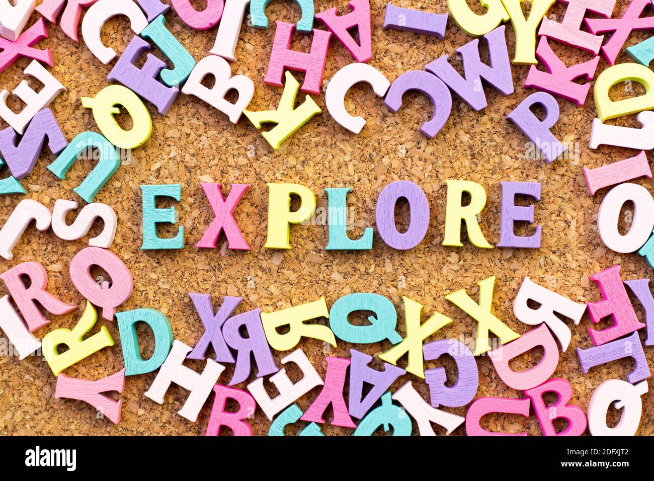 Color alphabet in word explore with another letter as frame on cork ...