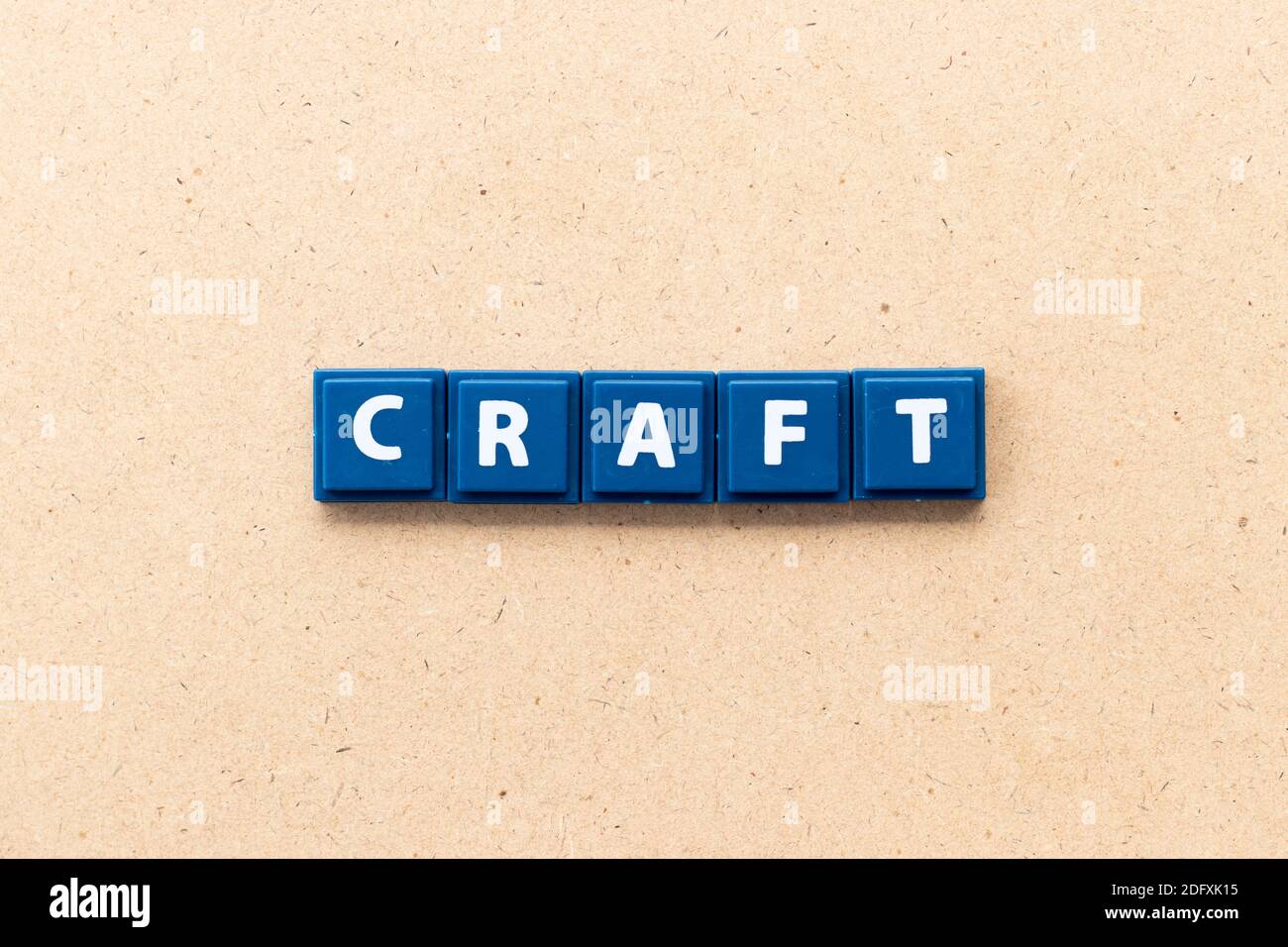 Tile letter in word craft on wood background Stock Photo - Alamy