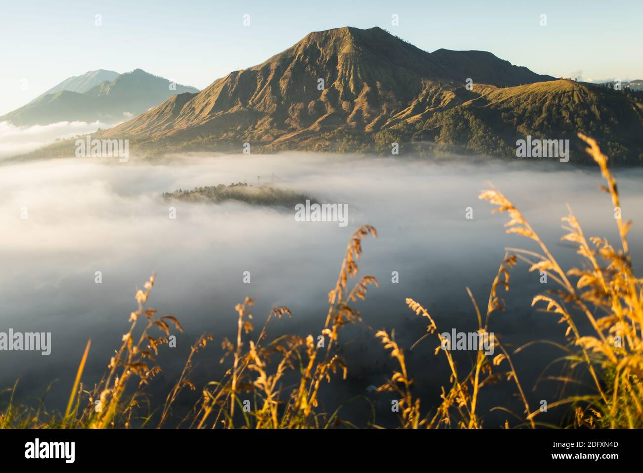 Sunrise view of mount Batur volcano in Bali from Pinggan village ...