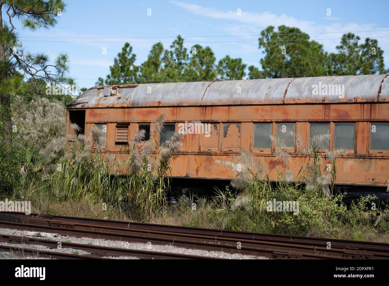 Abandoned old train on tracks photo Stock Photo - Alamy