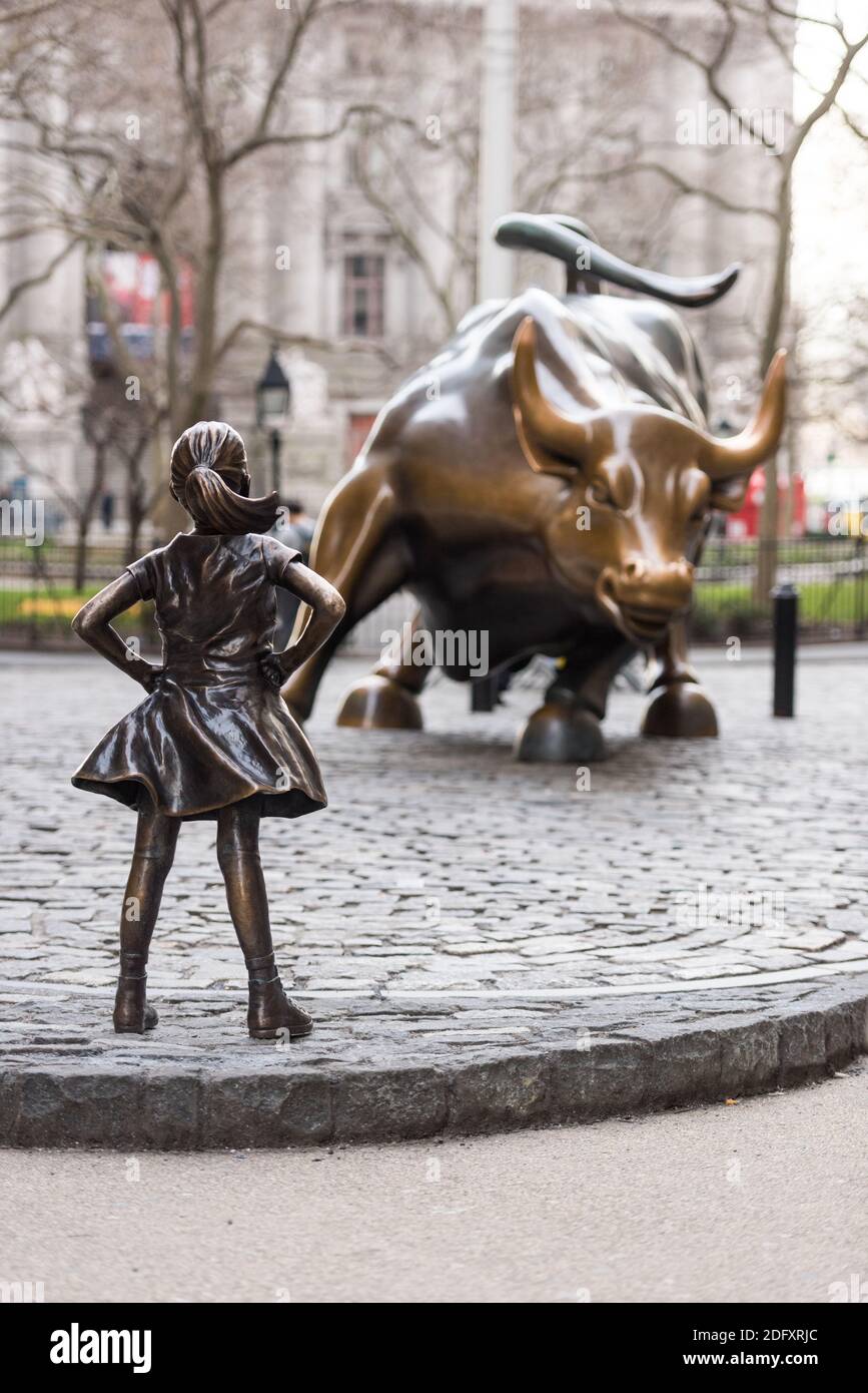 New York, USA. 3 Apr, 2017. Fearless girl facing off with the wall ...