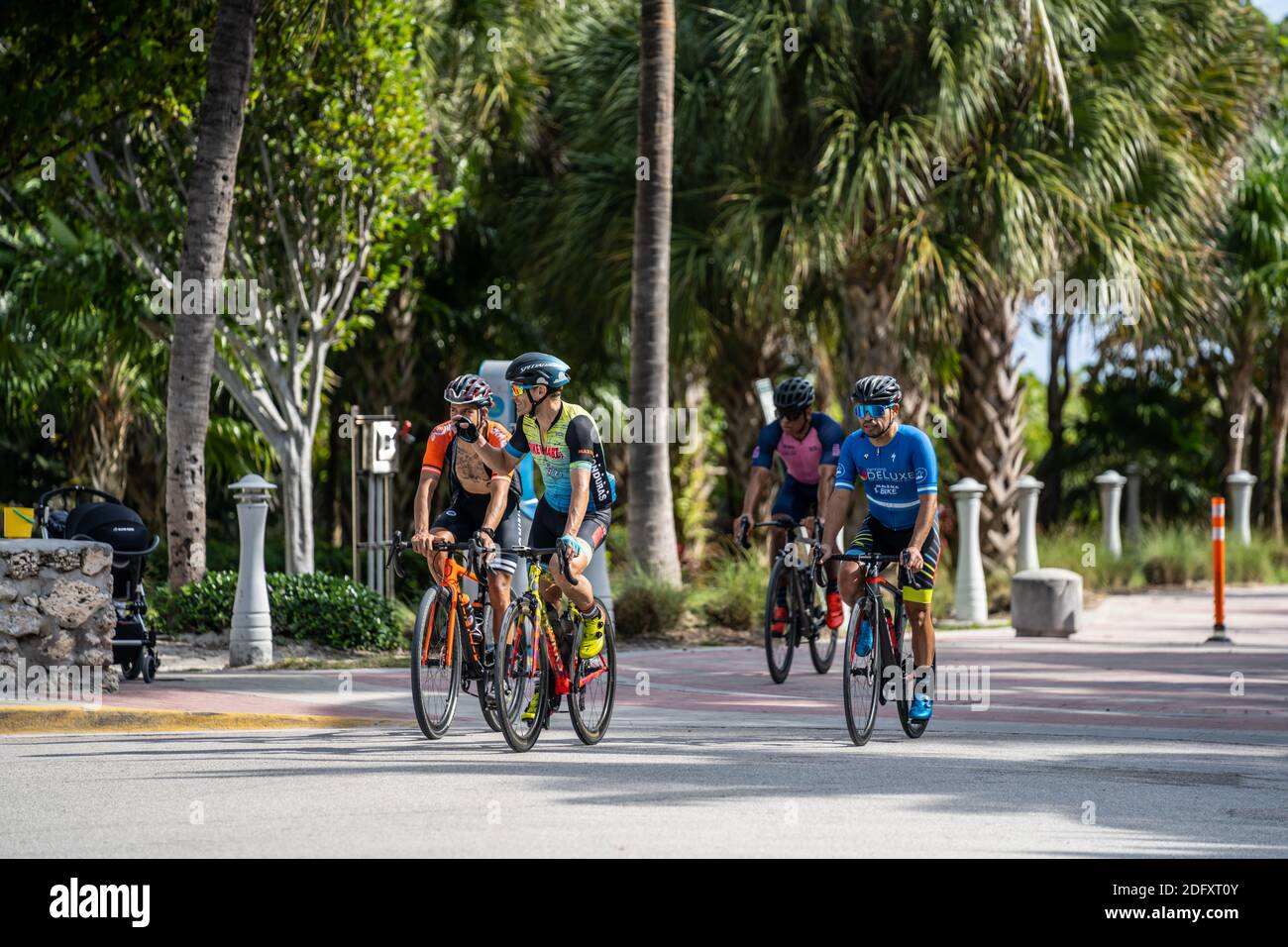 Street photography group of bikers cyclists in Miami Beach FL Stock ...