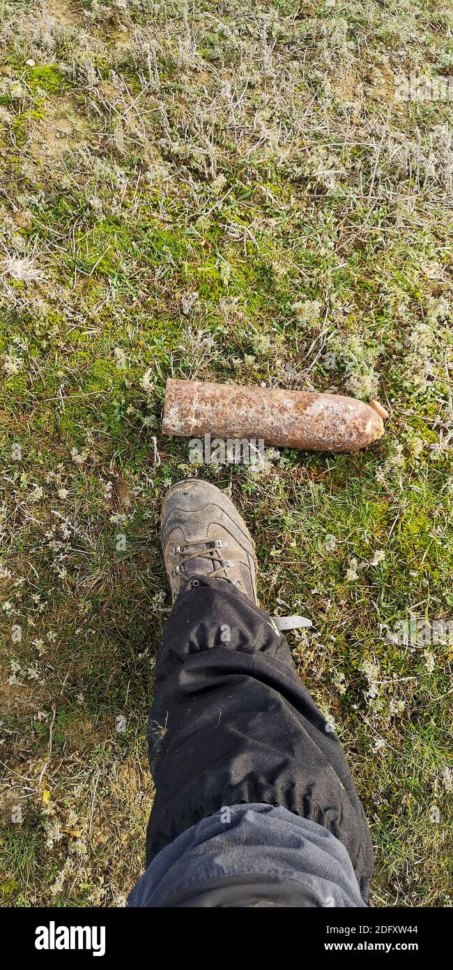 The bomb from World War II on the grass in the field in Romania Stock ...