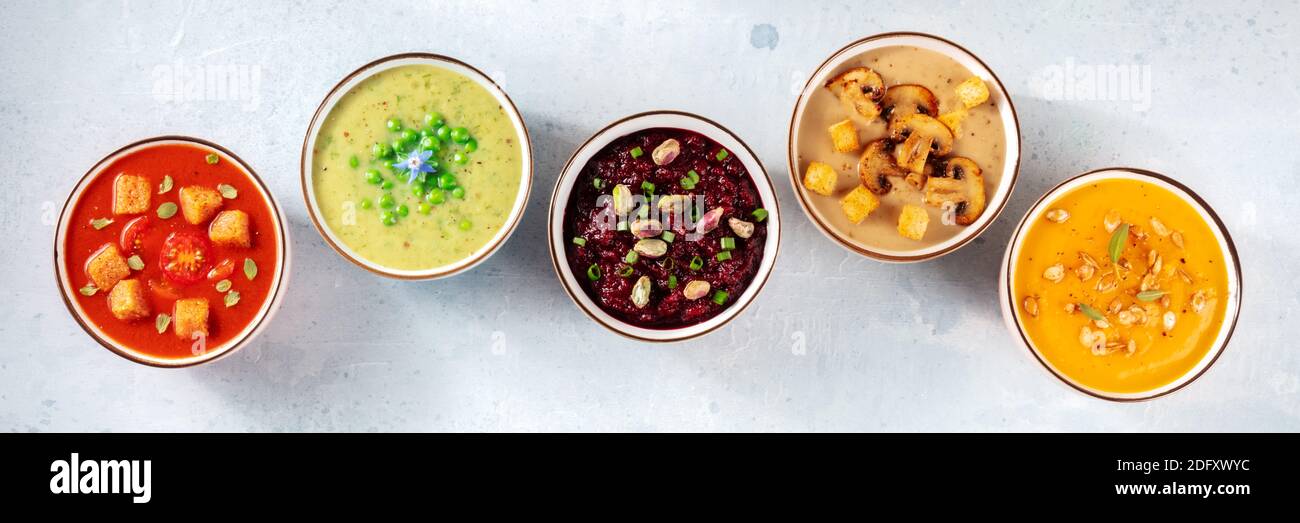 Vegan soup panorama. An assortment of cream soups, overhead flat lay ...