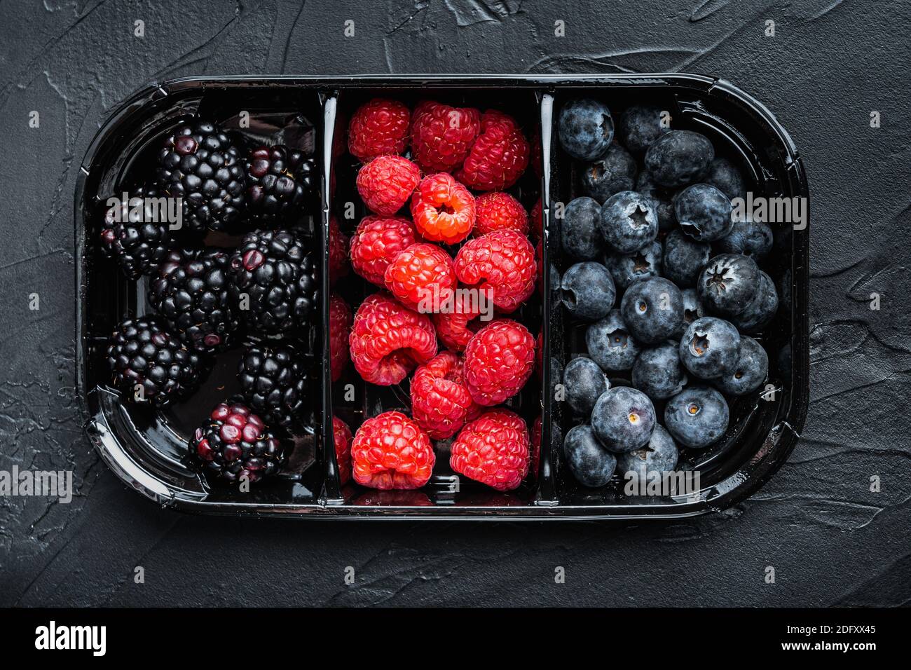 Berry platter, harvest of berries, blueberries, raspberry with ...