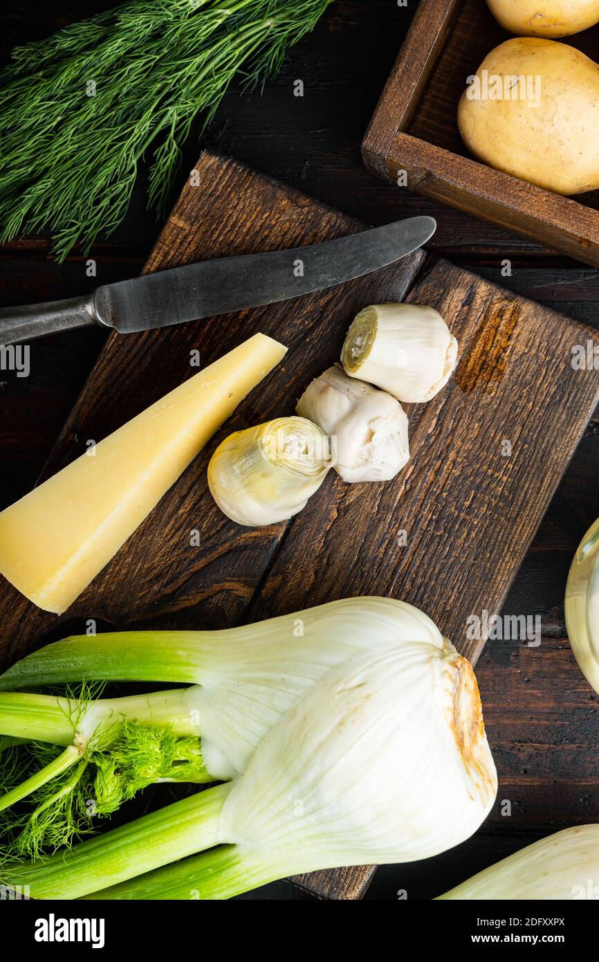 Potato and artichoke al forno ingredient, on old wooden table, top view ...