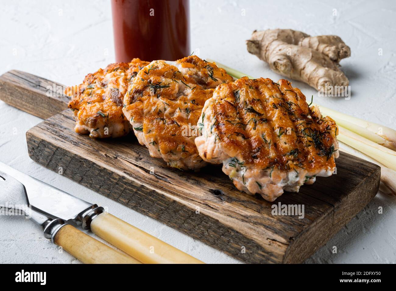 Grilled quick asian salmon cutlet, on white textured background Stock ...
