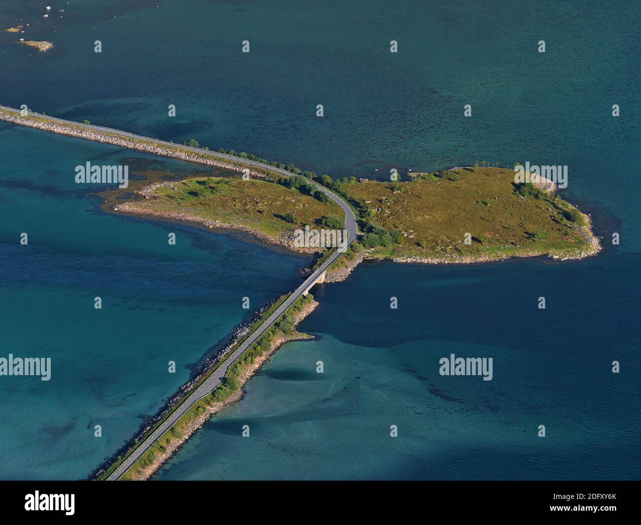 Stunning aerial view of small island Storholmen with roadway on fjord ...